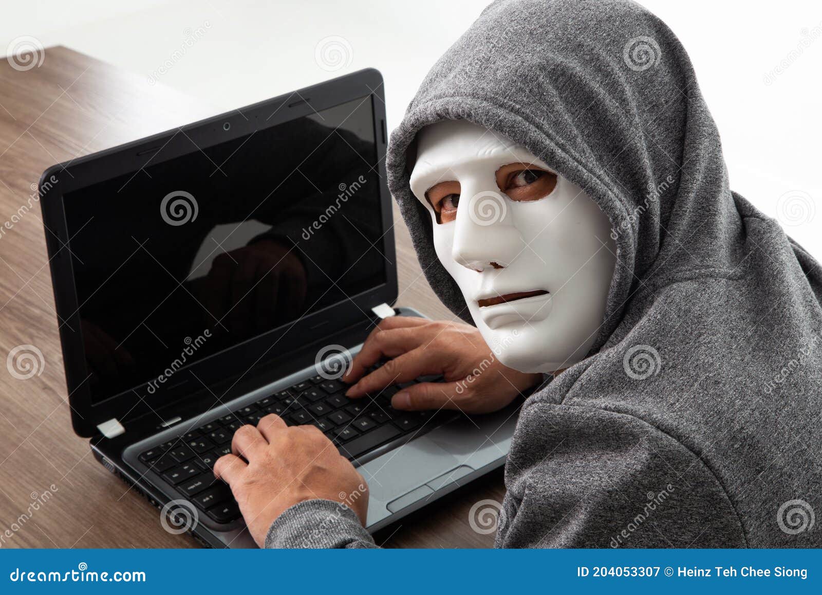 Thief Hacker in Mask Stealing Personal Information from Laptop Stock ...