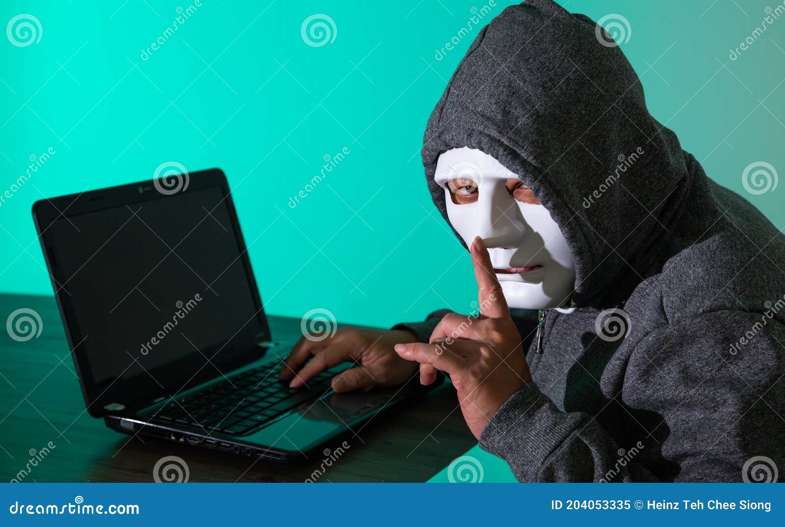 Thief Hacker in Mask Stealing Personal Information from Laptop Stock ...