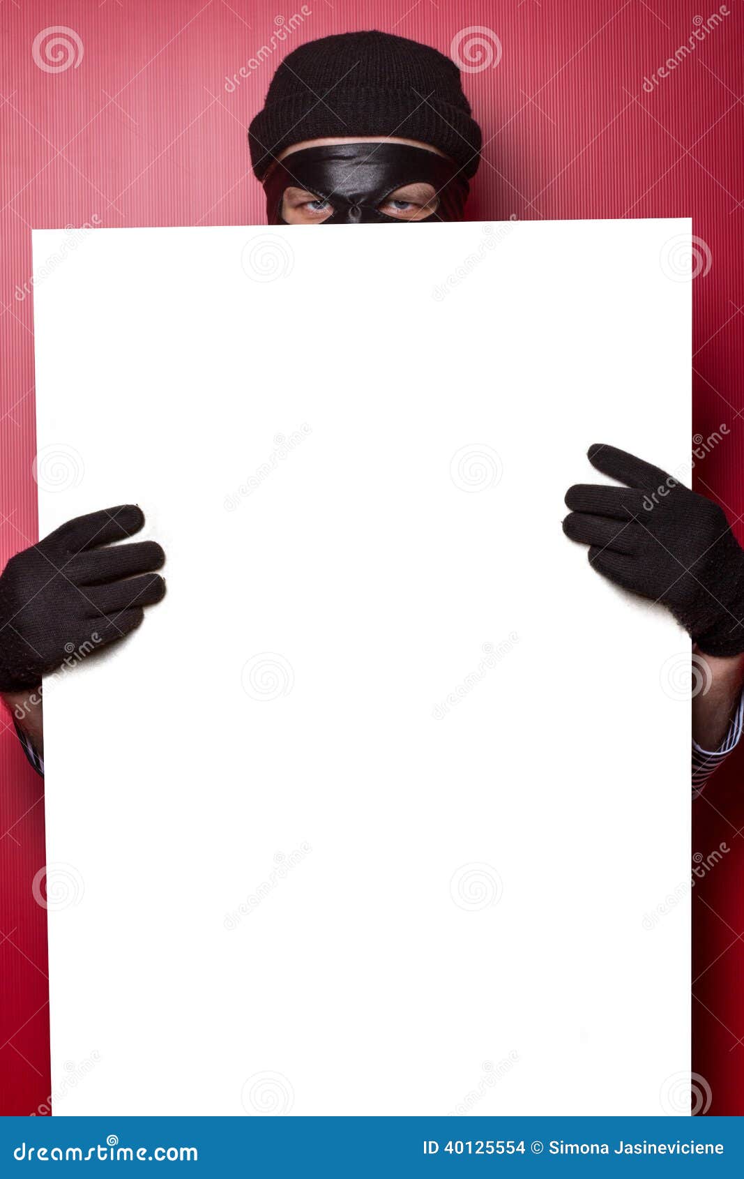 Thief hiding behind advert stock photo. Image of holder - 40125554
