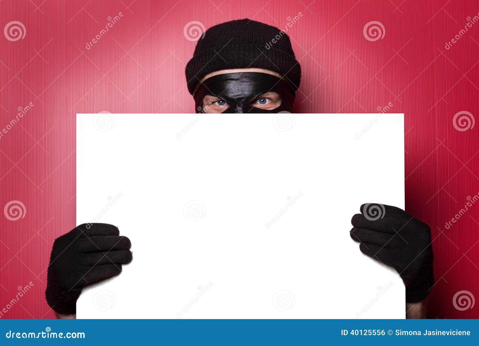 Thief hiding behind advert stock photo. Image of anonymous - 40125556