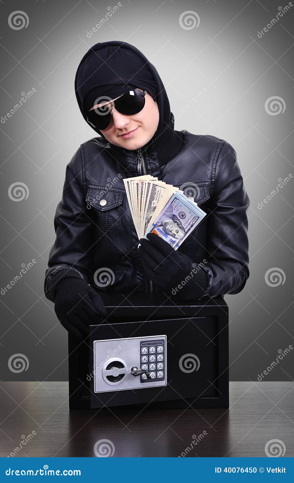 Thief Holding a Stolen Dollars Stock Photo - Image of crime, intruder ...