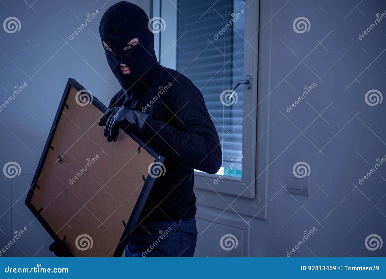 Thief Inside Home Stealing a Painting from Wall Stock Image - Image of ...