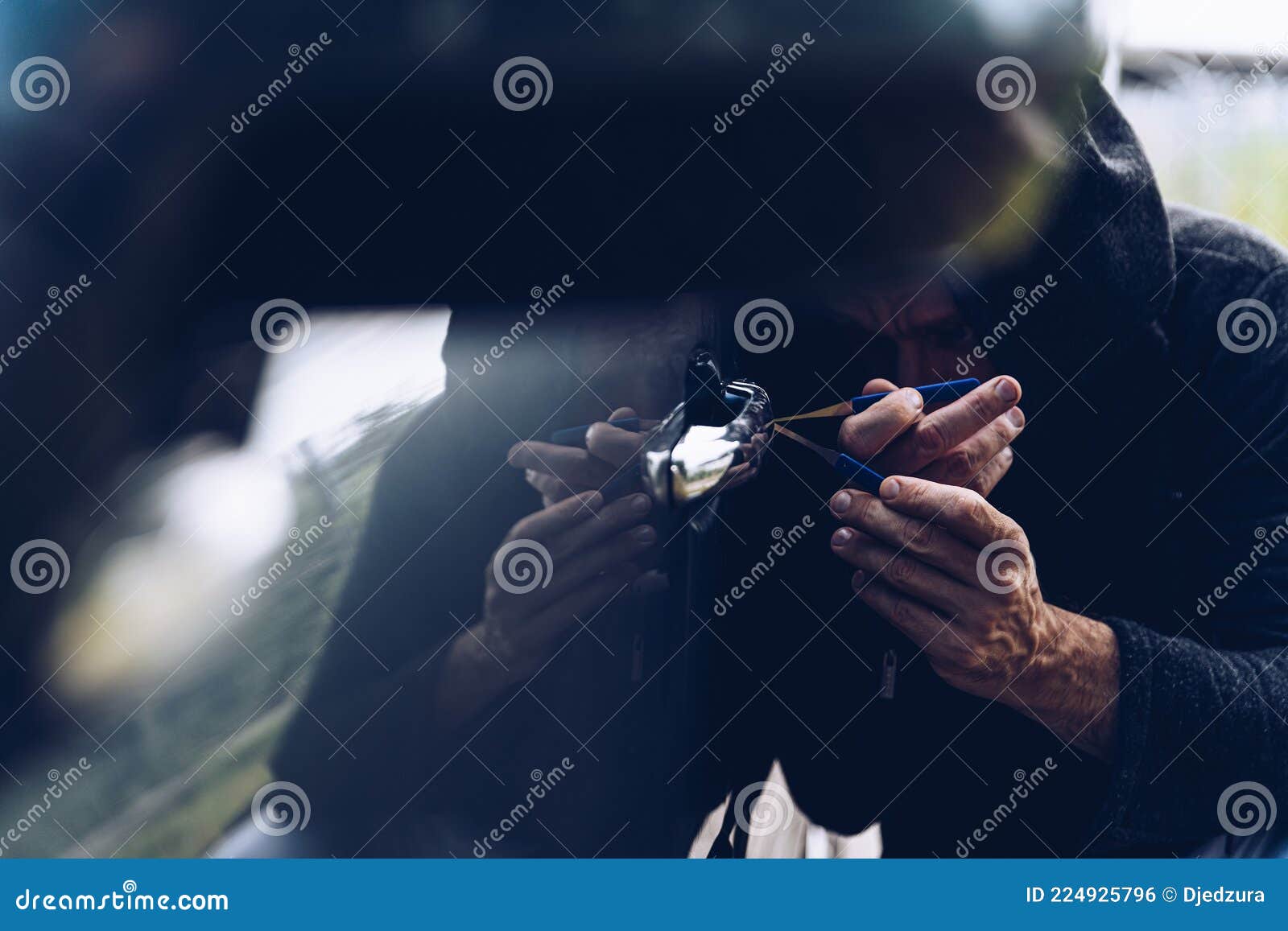 The Thief Opening a Car Door with a Lockpick. Stock Photo - Image of ...