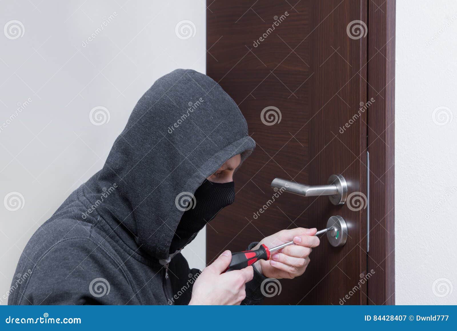 Thief opening lock stock image. Image of male, apartment - 84428407