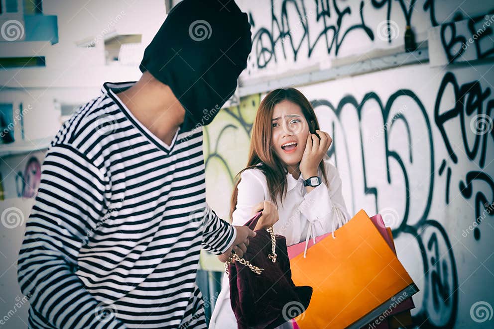 Thief Stealing a Black Leather Backpack Stealing Stock Image - Image of ...