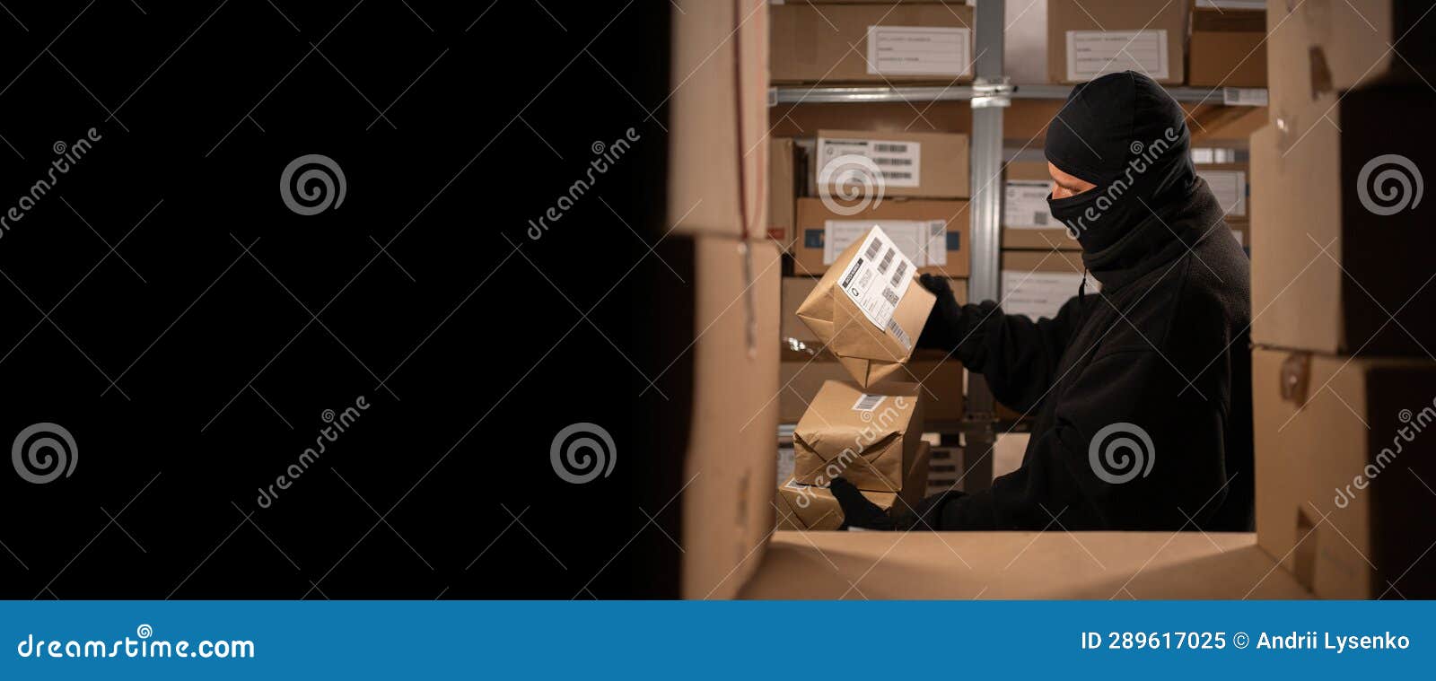 A Thief Stealing Boxes in a Warehouse at Night in the Dark. Warehouse ...