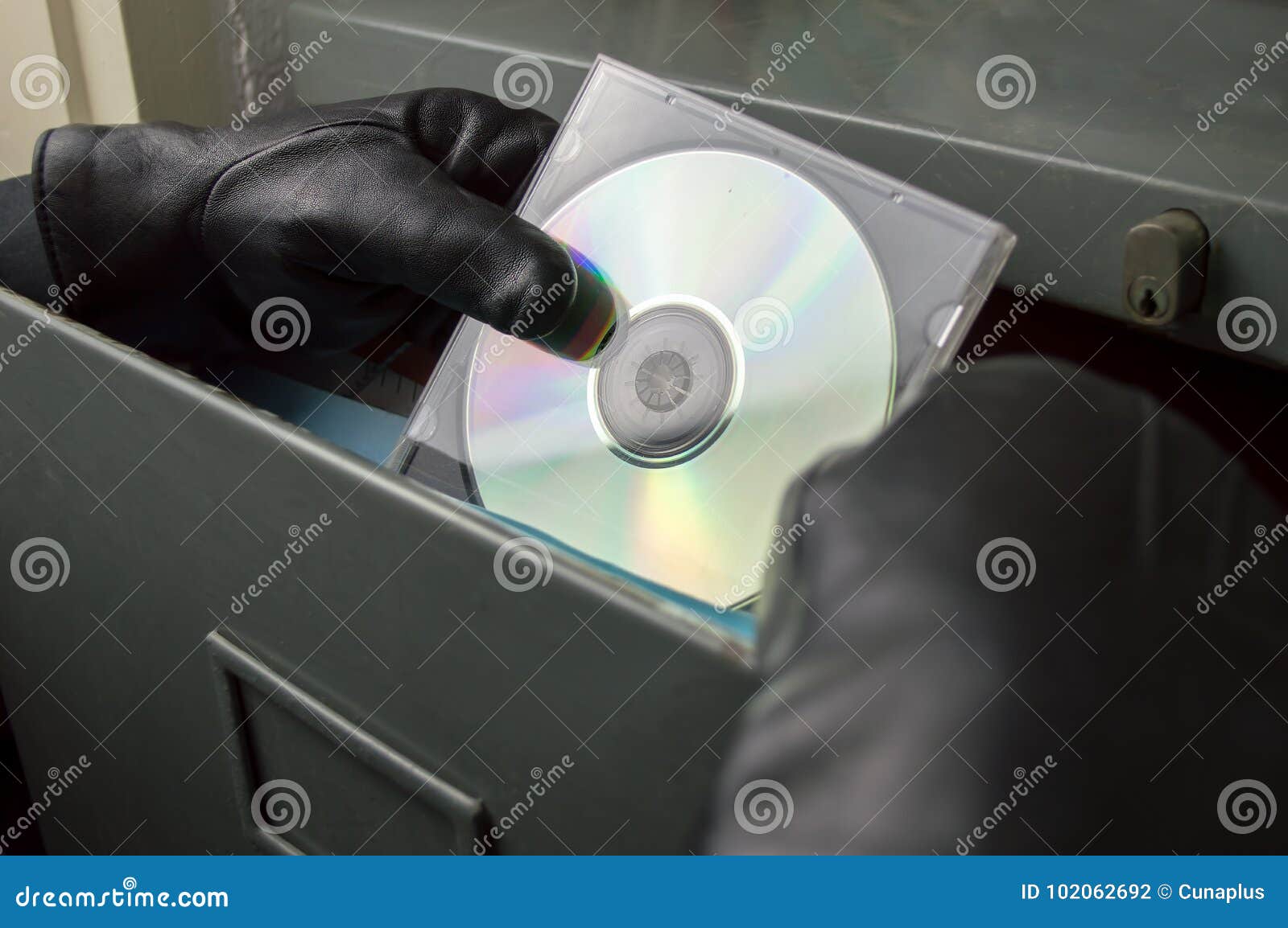 Thief Stealing Documents in Compact Disc Stock Photo - Image of hide ...