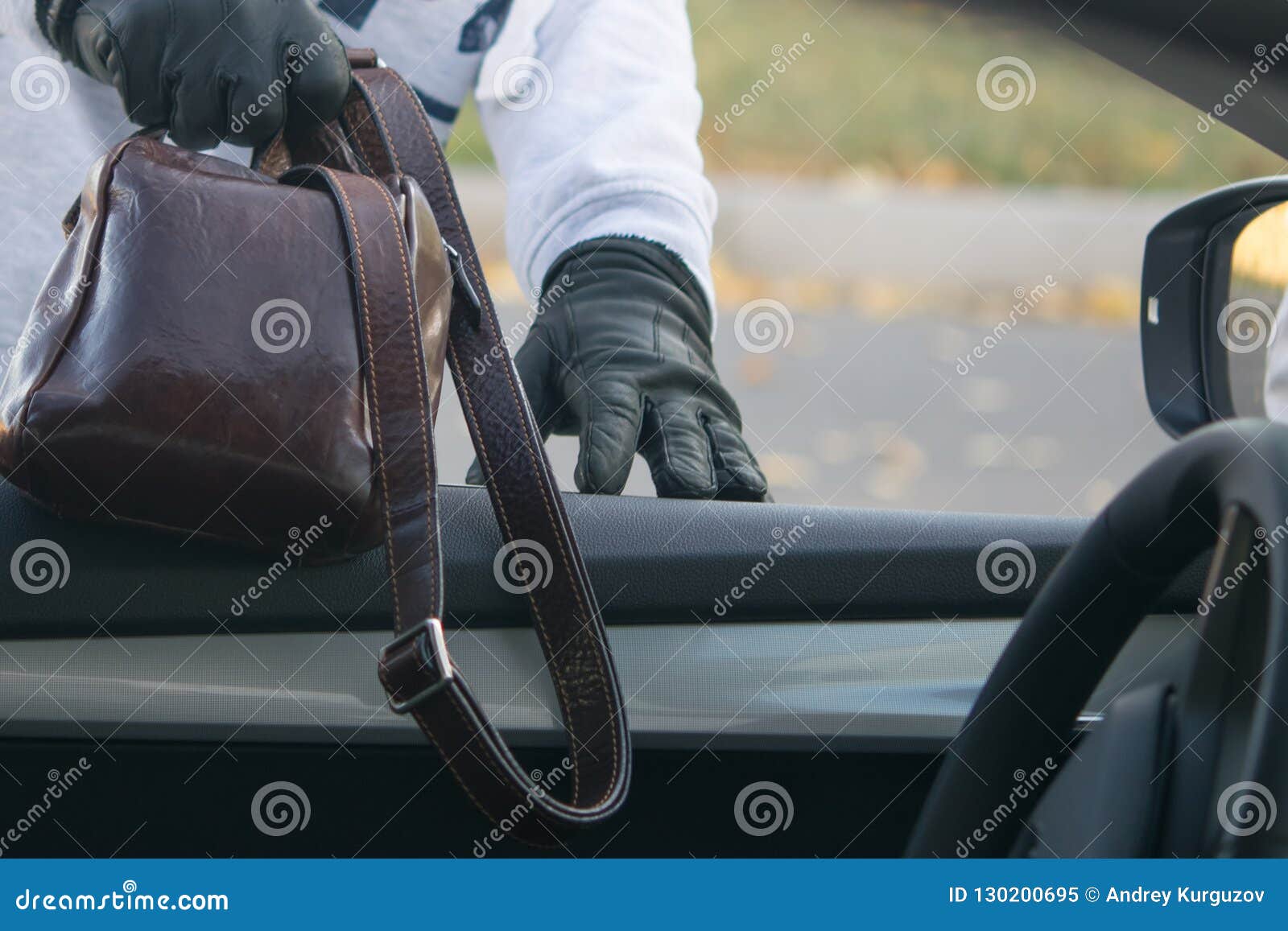 The Thief Steals a Bag with Documents through a Window of the Car, Left ...