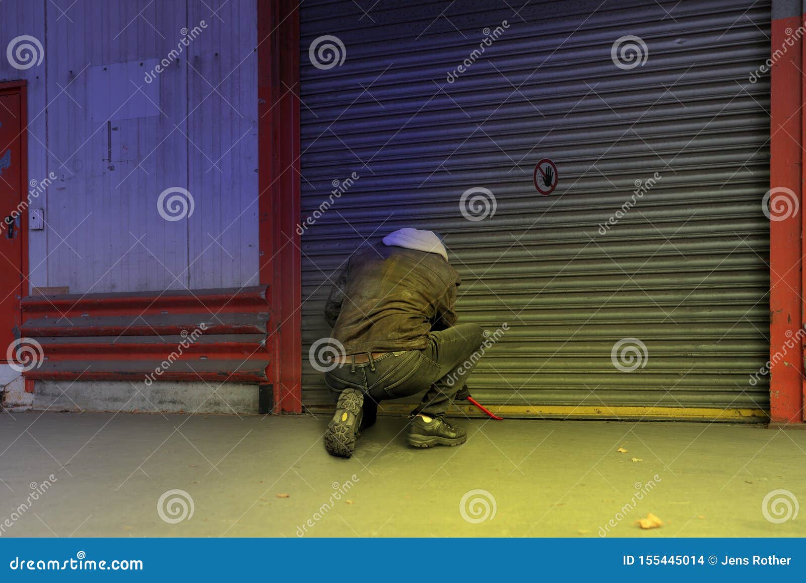 A Thief Tries To Break a Gate at a Company with a Crowbar Stock Photo ...