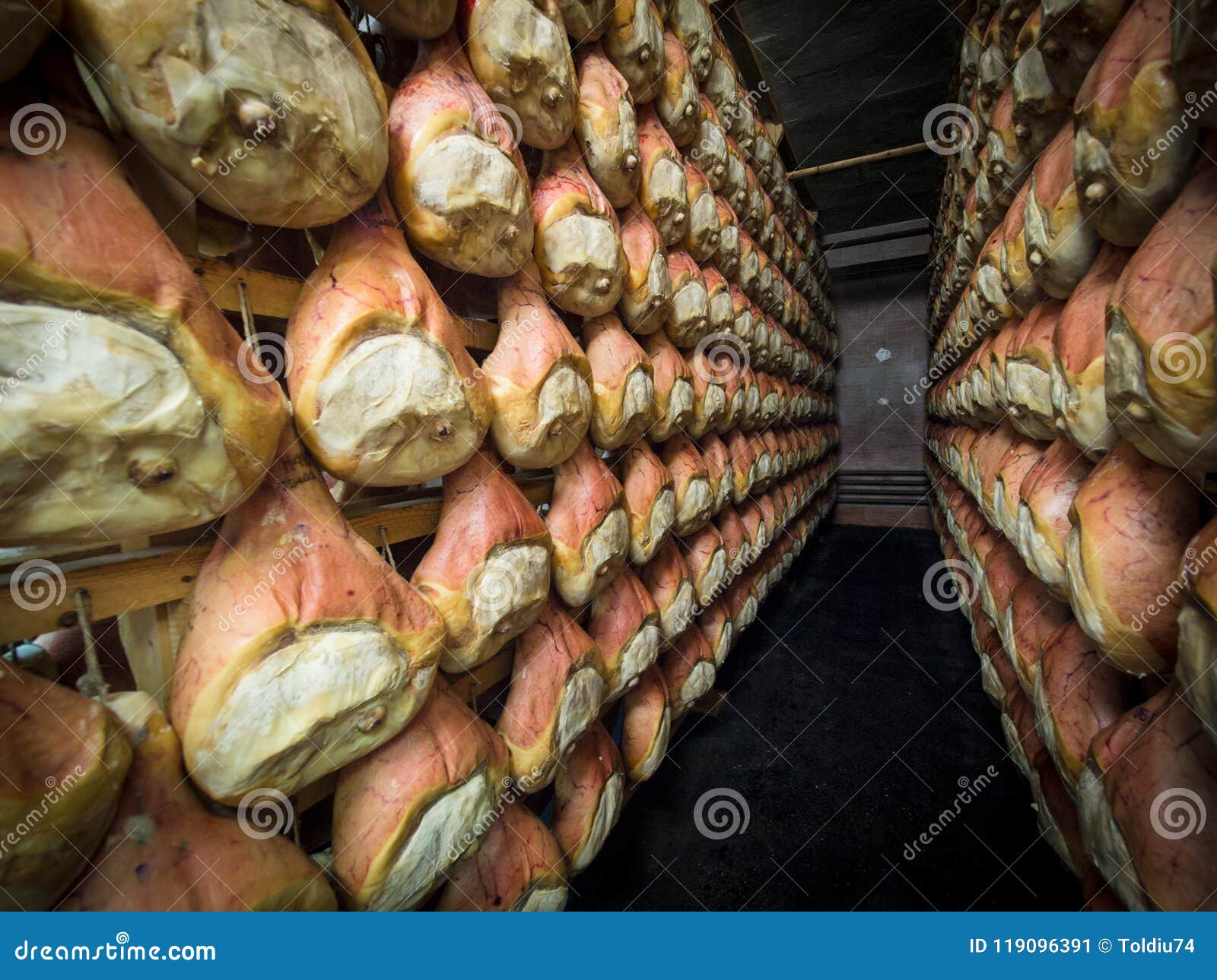 Thighs of Ham during the Seasoning Process Hanging in a Cellar. Stock ...