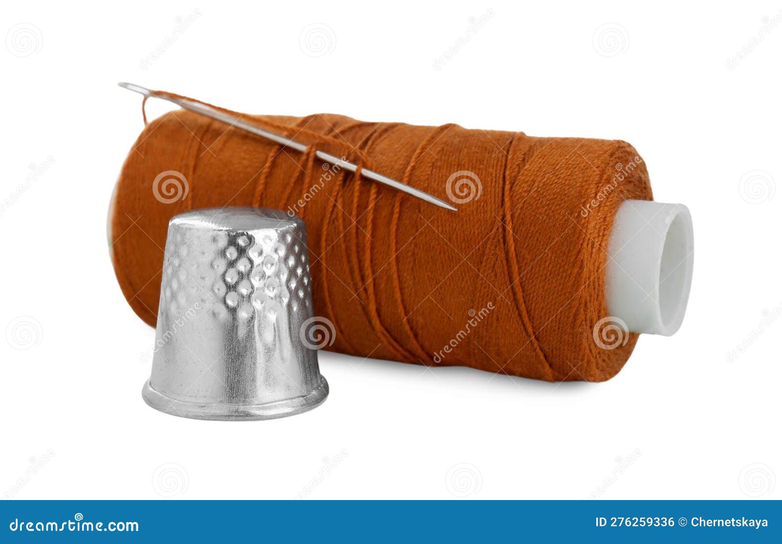 Thimble and Spool of Brown Sewing Thread with Needle Isolated on White ...
