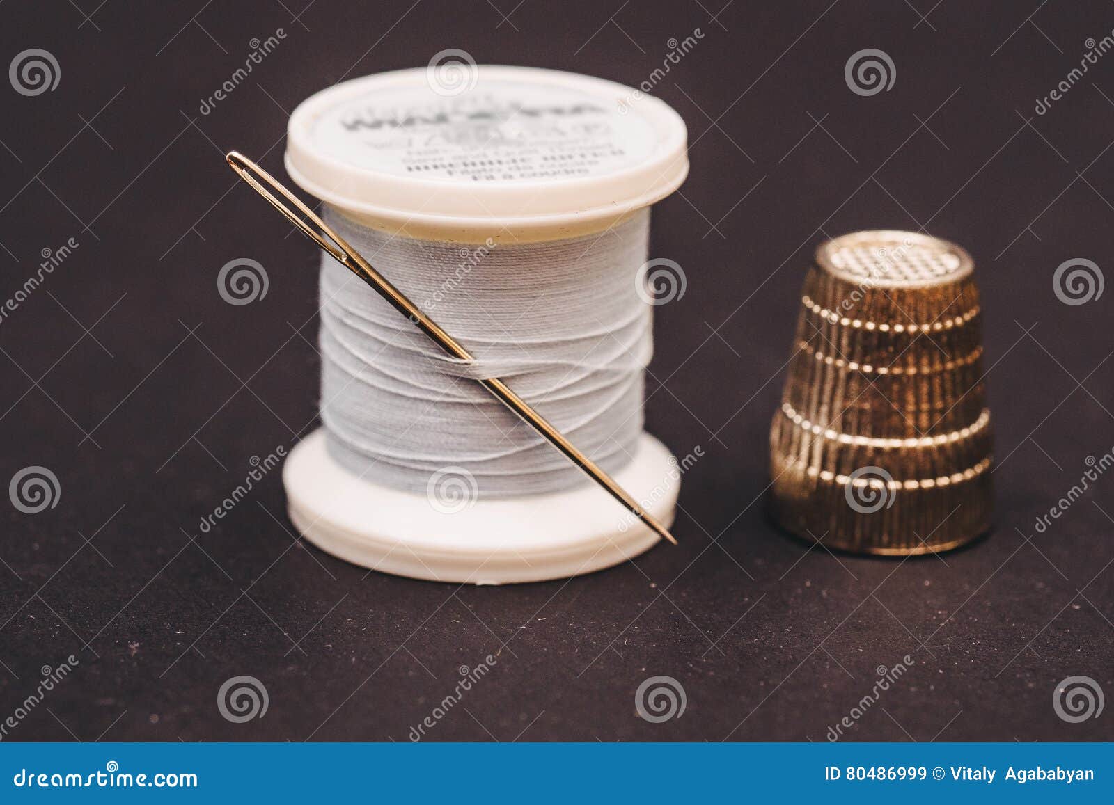 Thimble and Thread with Needle on Table Stock Image - Image of craft ...