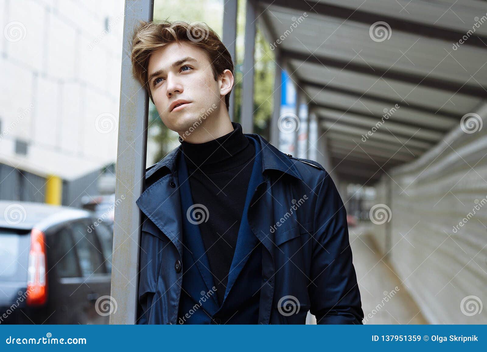 Thin, Attractive Young Man Standing on the Street, Leaning on the Frame ...