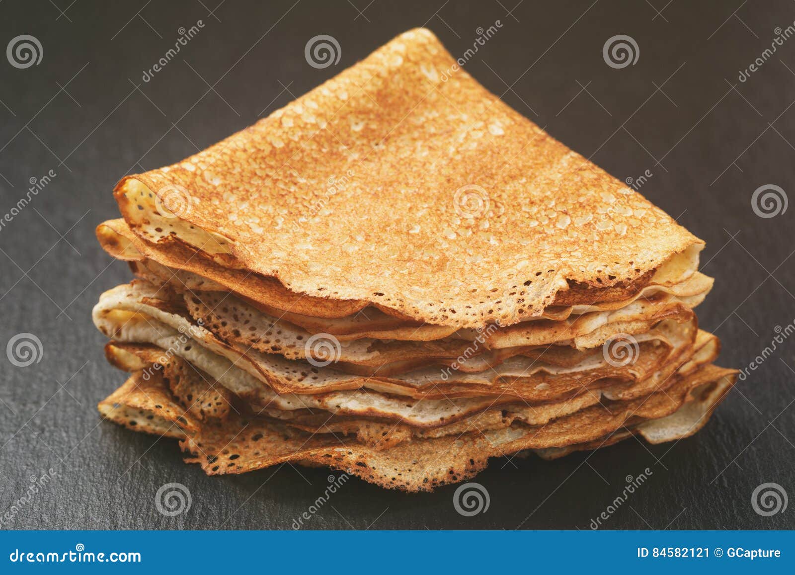 Thin Crepes or Blinis Folded in Triangles on Slate Board Stock Image ...