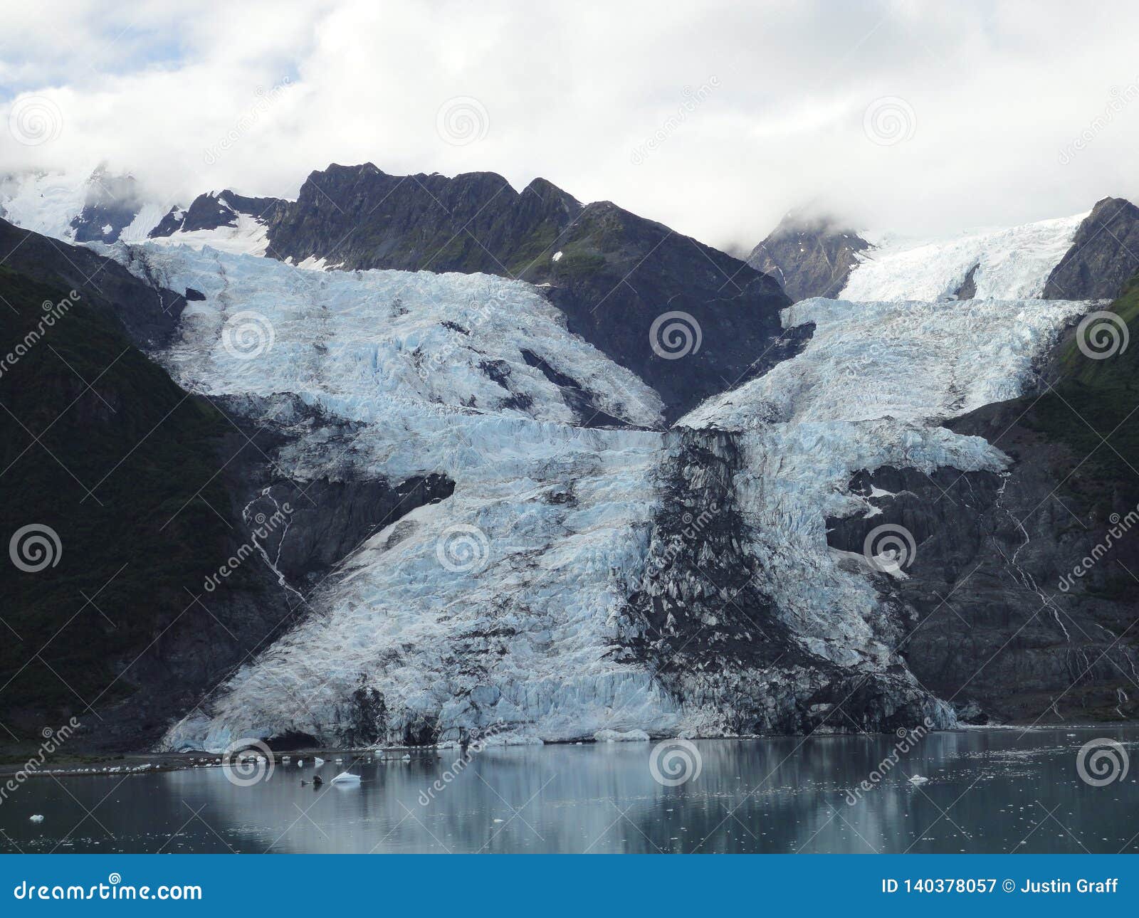 Thin Glacier between Two Mountains Slowly Gliding into the Pacific ...