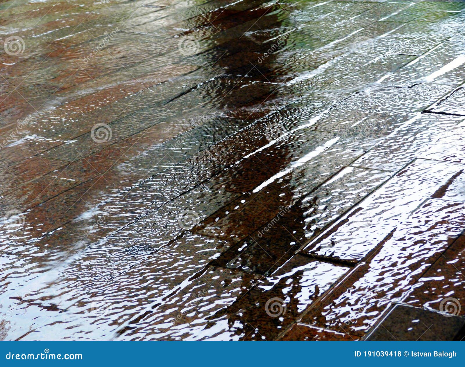 Thin Layer of Rain Water Flowing Over Top of Red Granite Pavement Stock ...