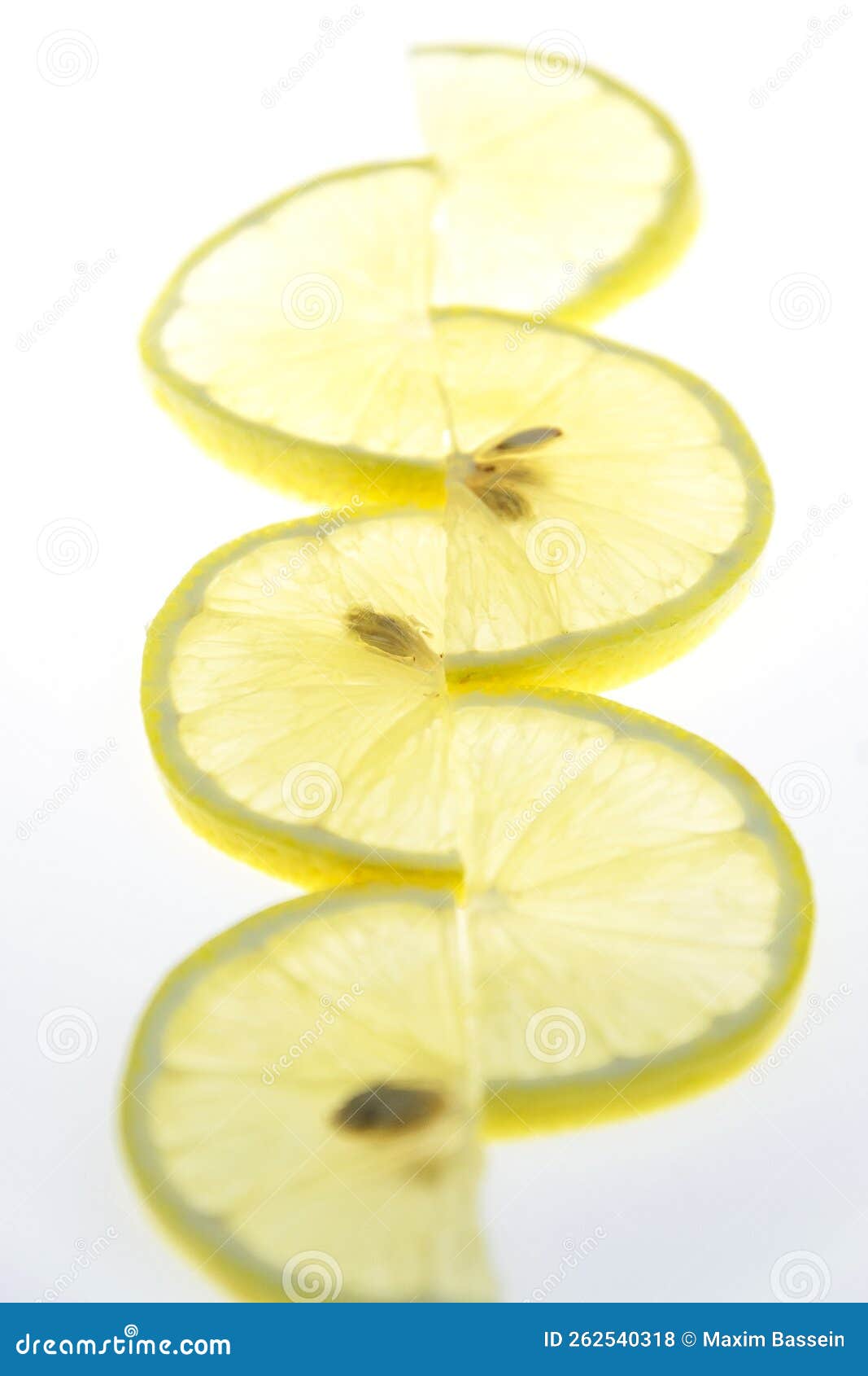 Thin Lemon Slices are Folded in a Pattern on a White Background Stock ...