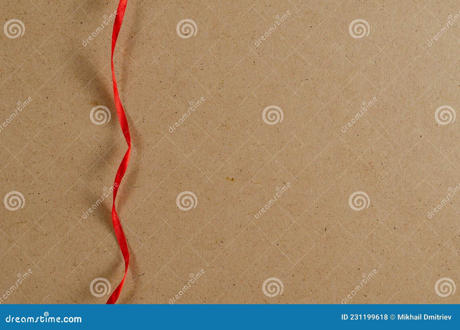 A Thin Red Ribbon Vertically Against the Brown Background. Stock Photo ...