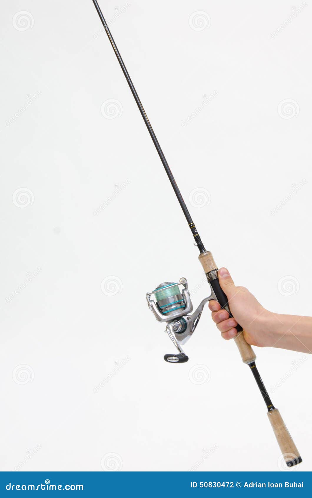 Thin Rod with Attached Reel in Hand Stock Photo - Image of studio ...