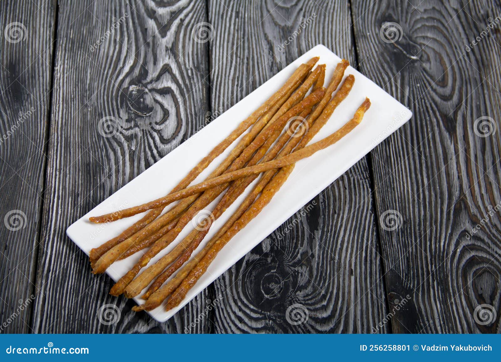 Thin Sausages for Beer. on a Rectangular Plate. Background from Pine ...