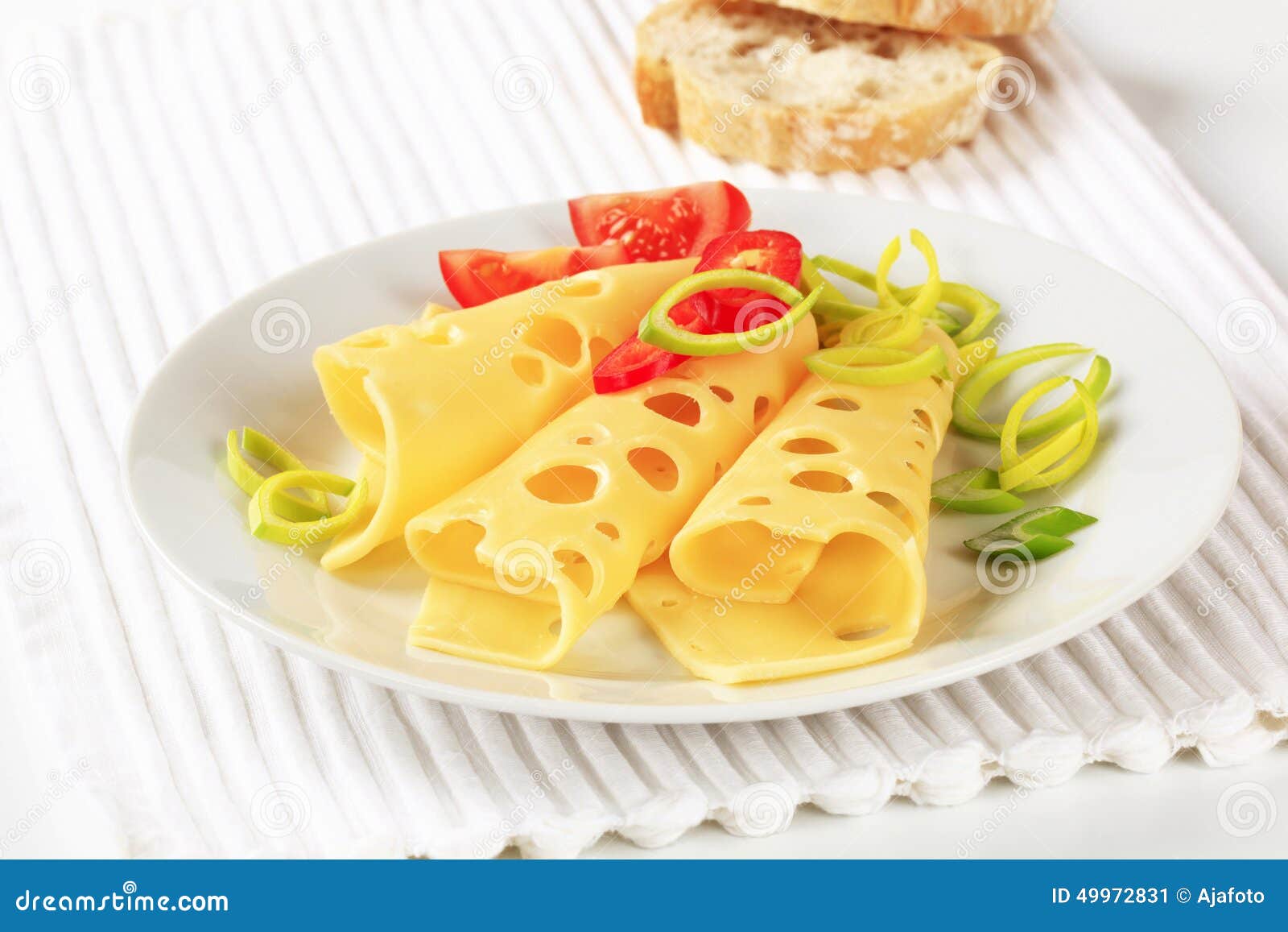 Thin-sliced Swiss cheese stock image. Image of place - 49972831