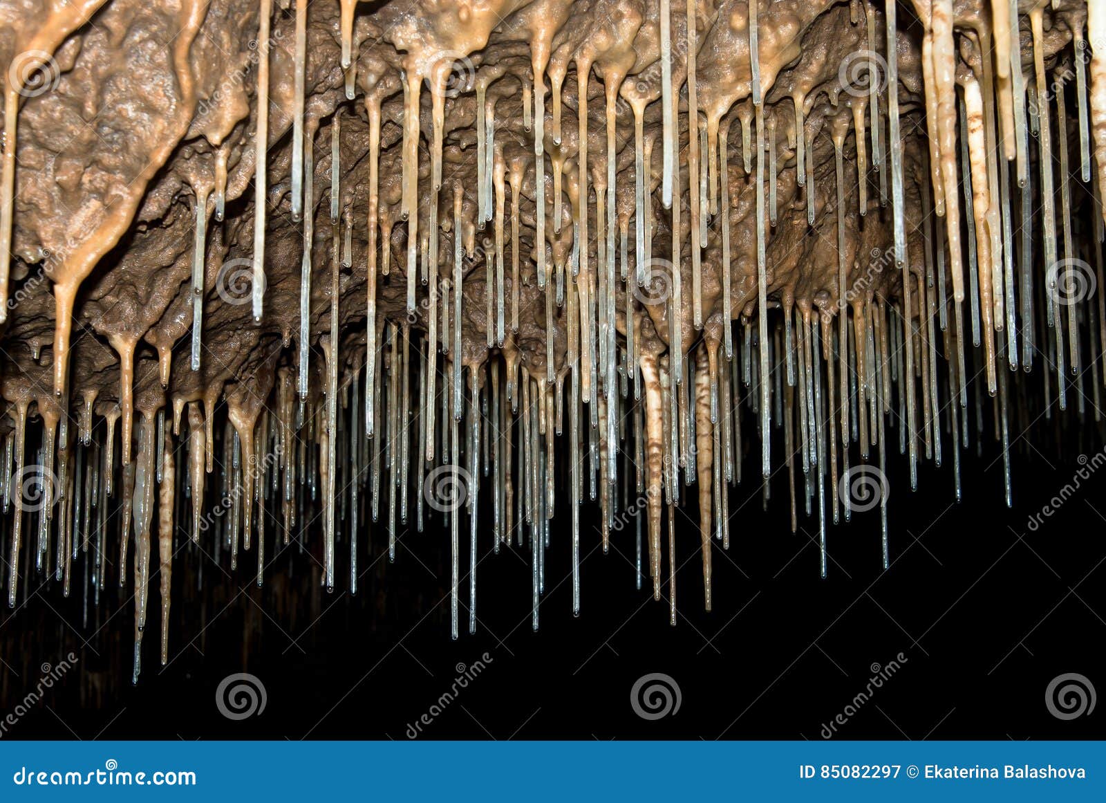 Thin stalactites in a cave stock image. Image of rock - 85082297