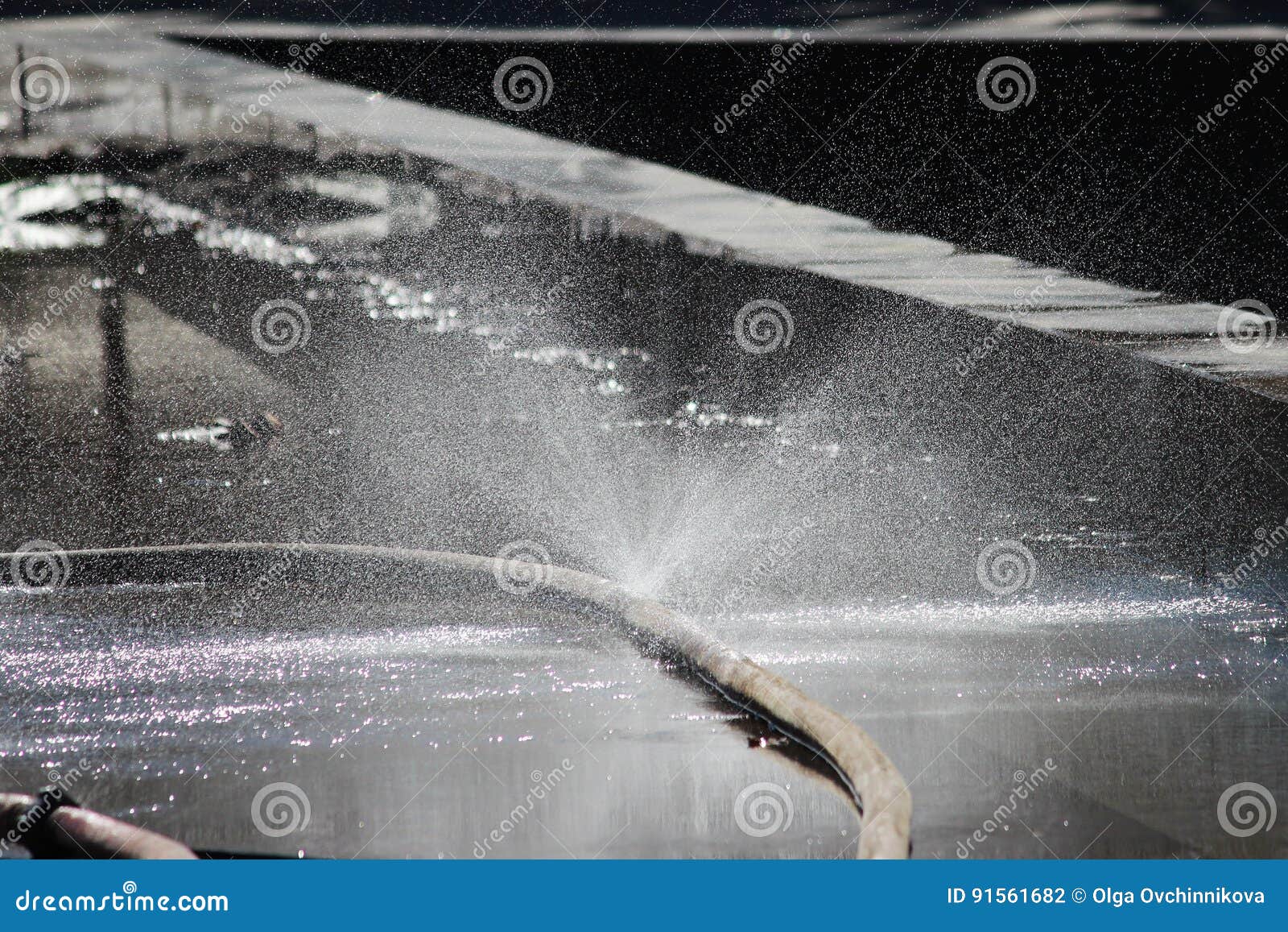 Thin Streams of Water from the Hose in Front of the Sunlight in the ...
