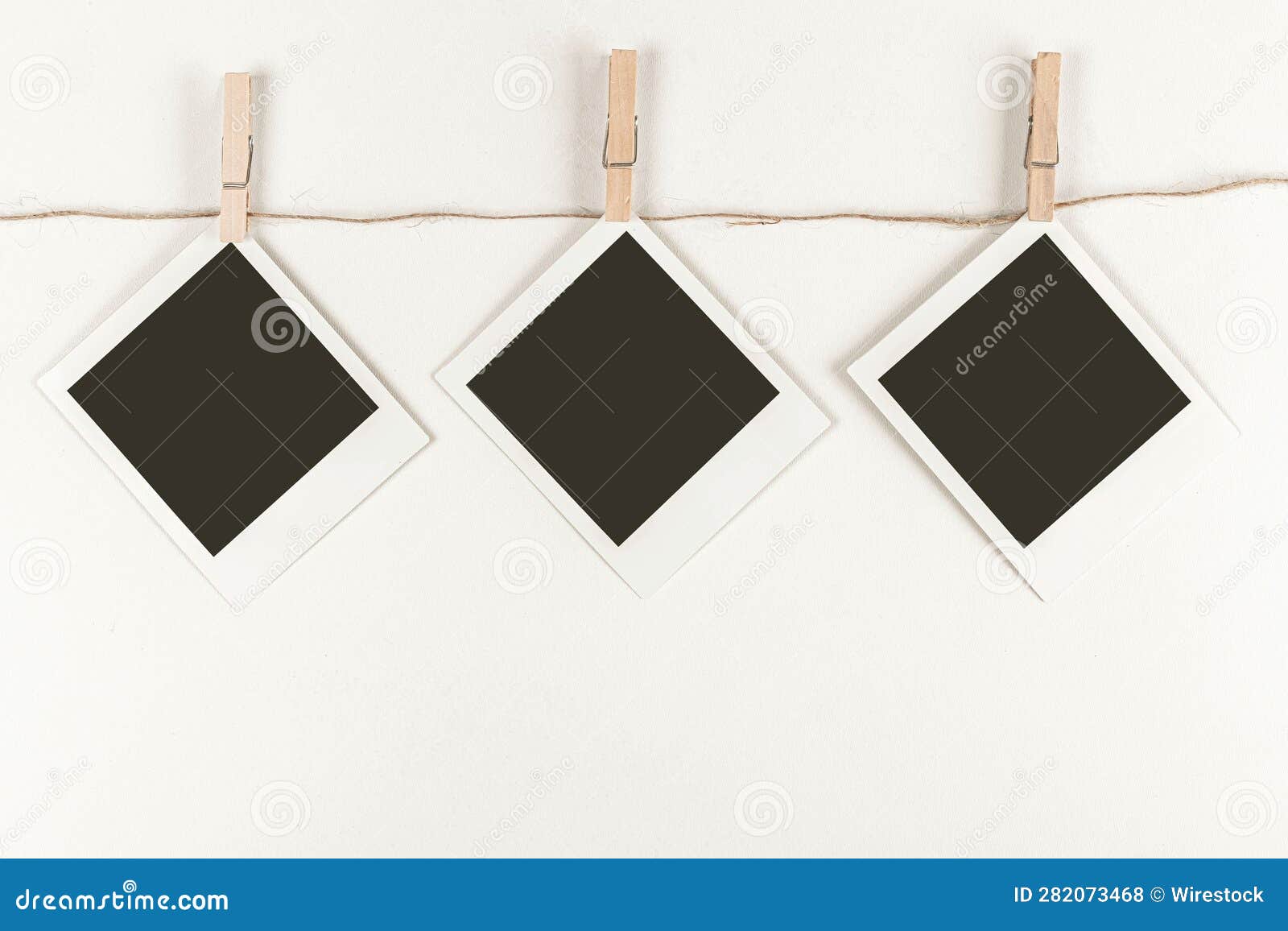 Thin Thread with Polaroid Photographs Suspended from the Line Stock ...