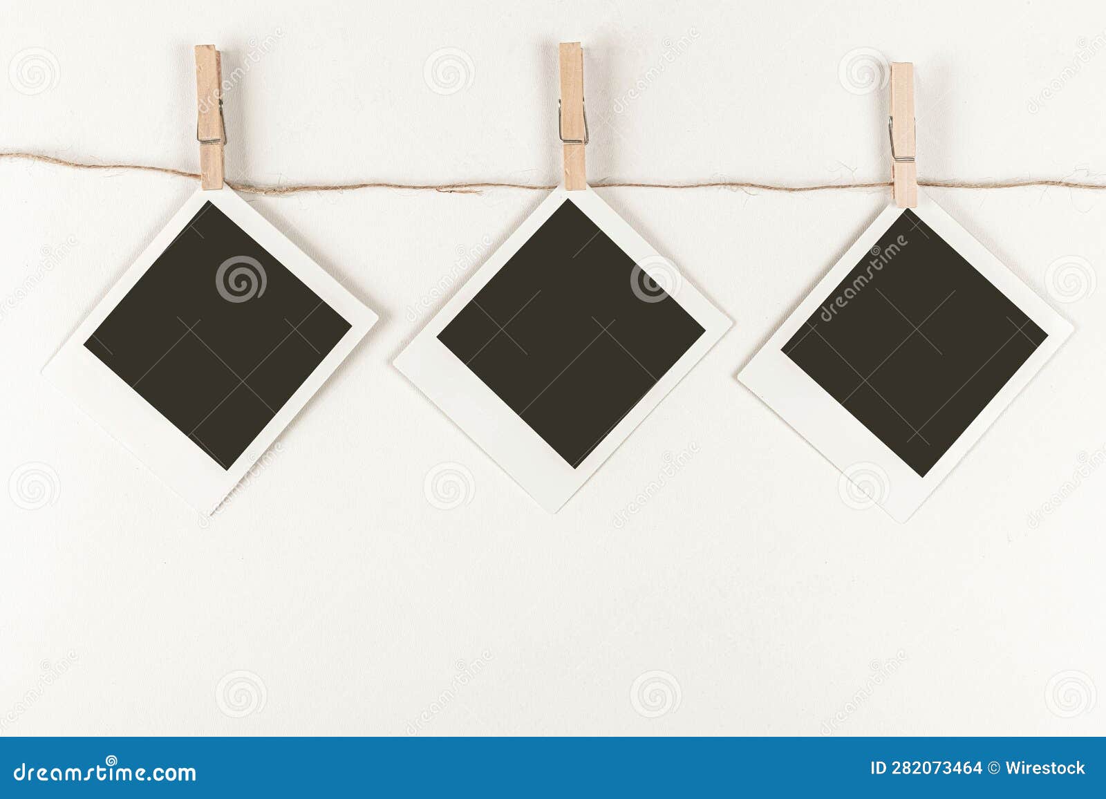 Thin Thread with Polaroid Photographs Suspended from the Line Stock ...