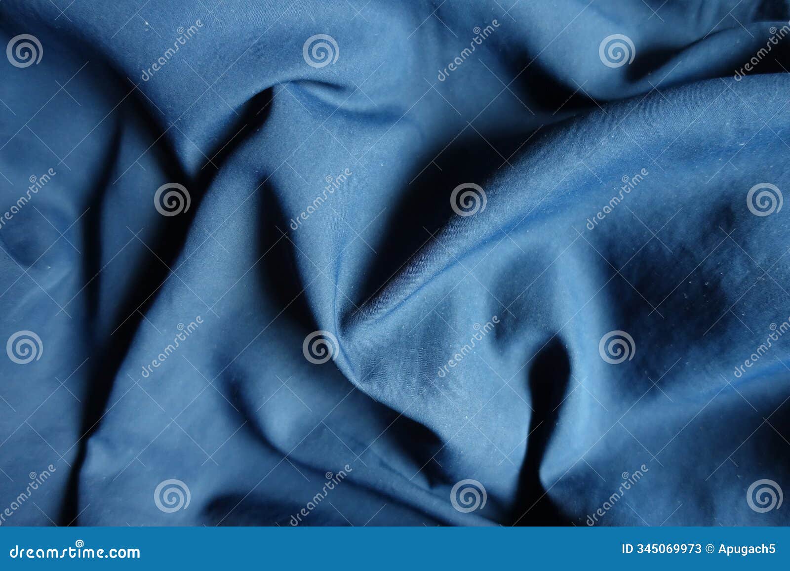 Thin Unprinted Blue Polyester Fabric in Soft Folds Stock Image - Image ...