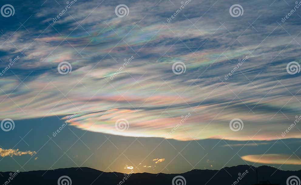 Thin Wispy Clouds Creating Rainbow Patterns of Scattered Sunlight ...
