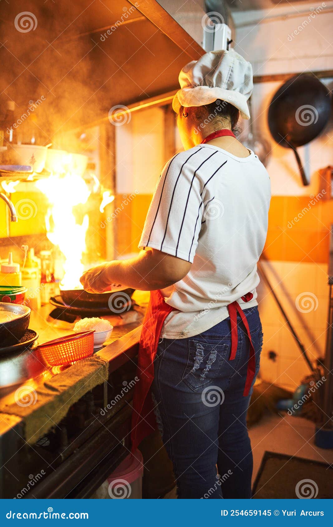 Things are Getting Hot in the Kitchen. Rearview Shot of a Cook ...