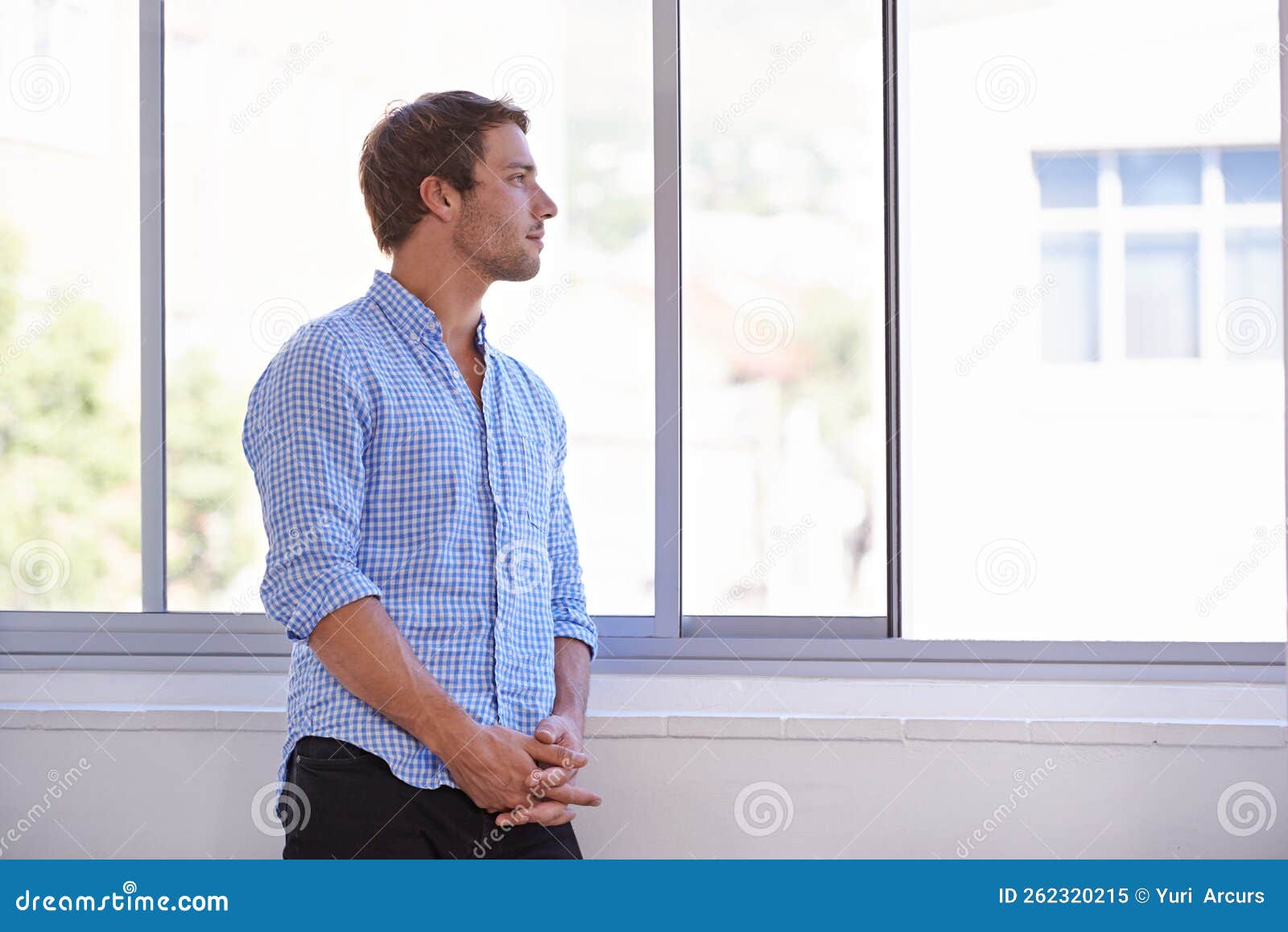 Things on His Mind. a Handsome Young Man Staring Out of a Window. Stock ...