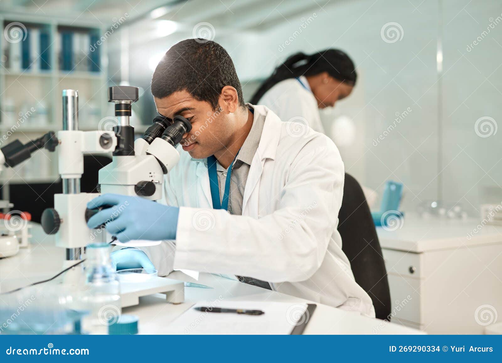 Things Look Different Under the Lens. a Young Scientist Using a ...