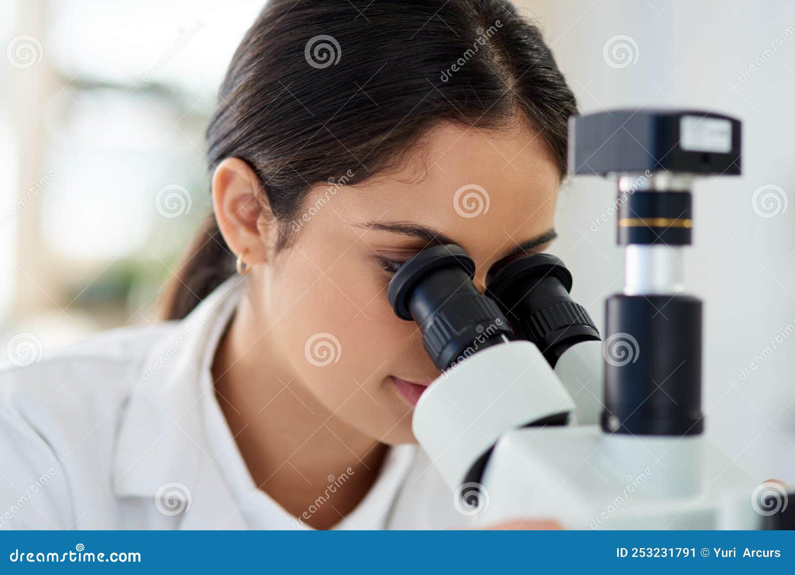 Things are a Lot Different Under the Lens. a Young Scientist Using a ...
