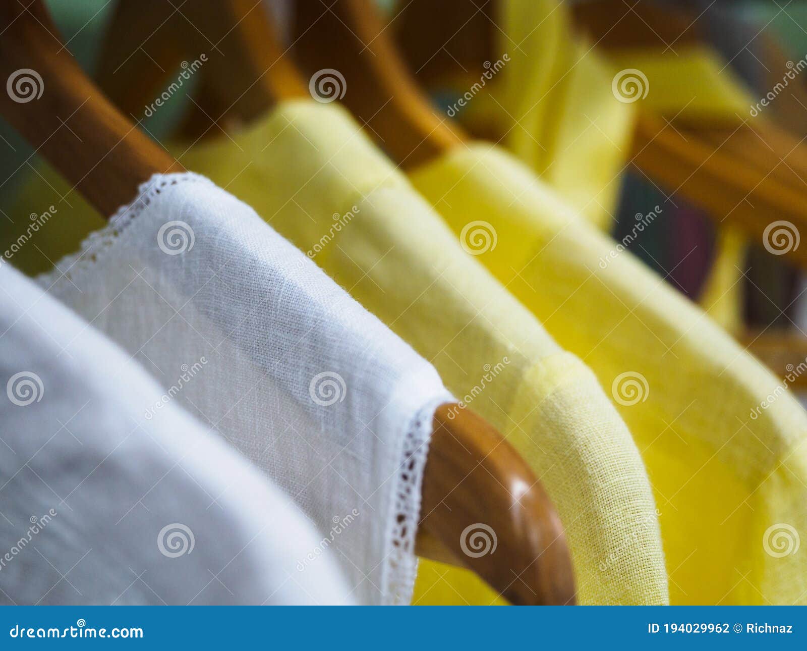 Things Made of Natural Linen in Different Colors Hang on Hangers in the ...