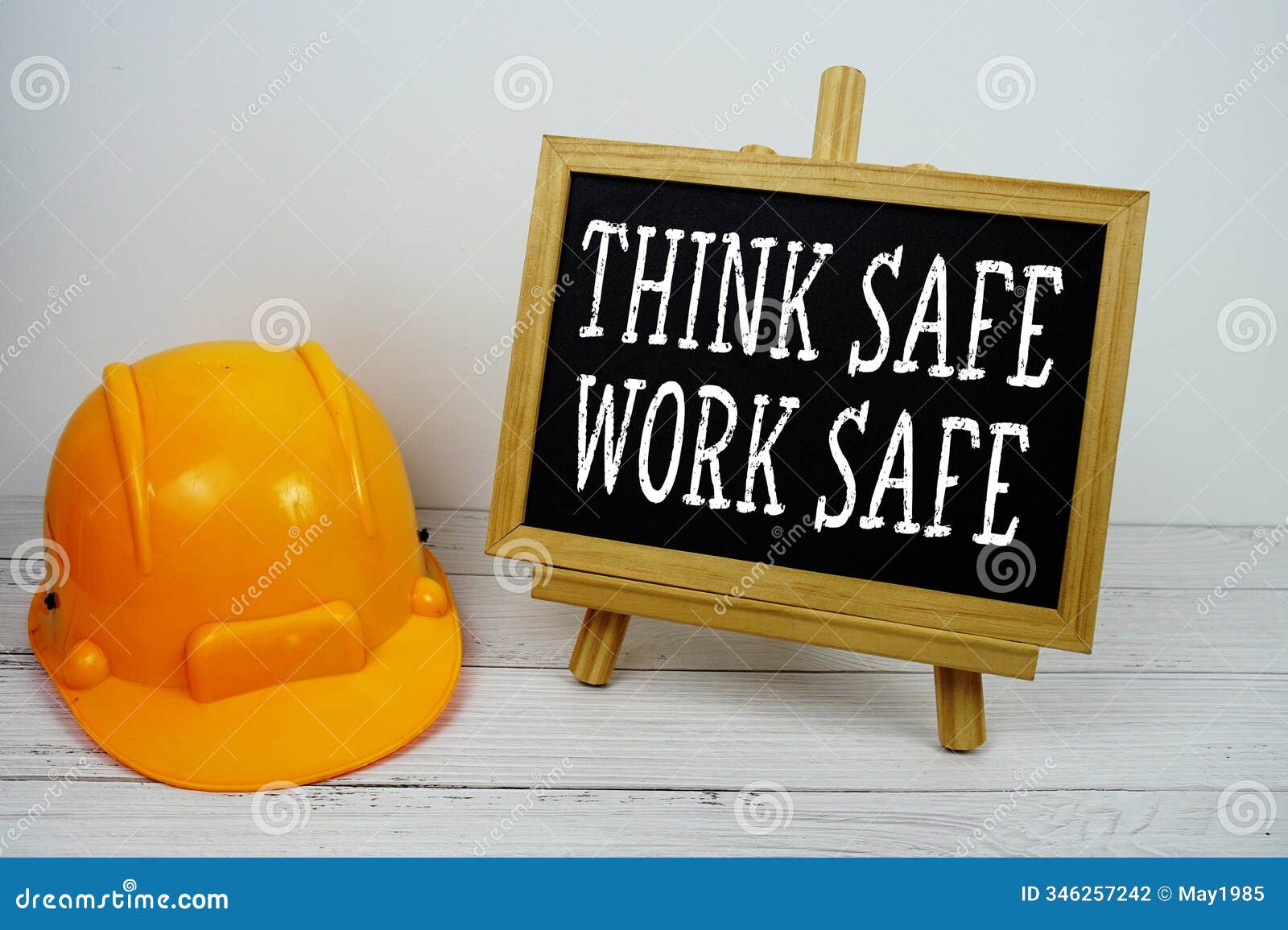 Think Safe Work Safe Text on Blackboard with Safety Helmet on Wooden ...
