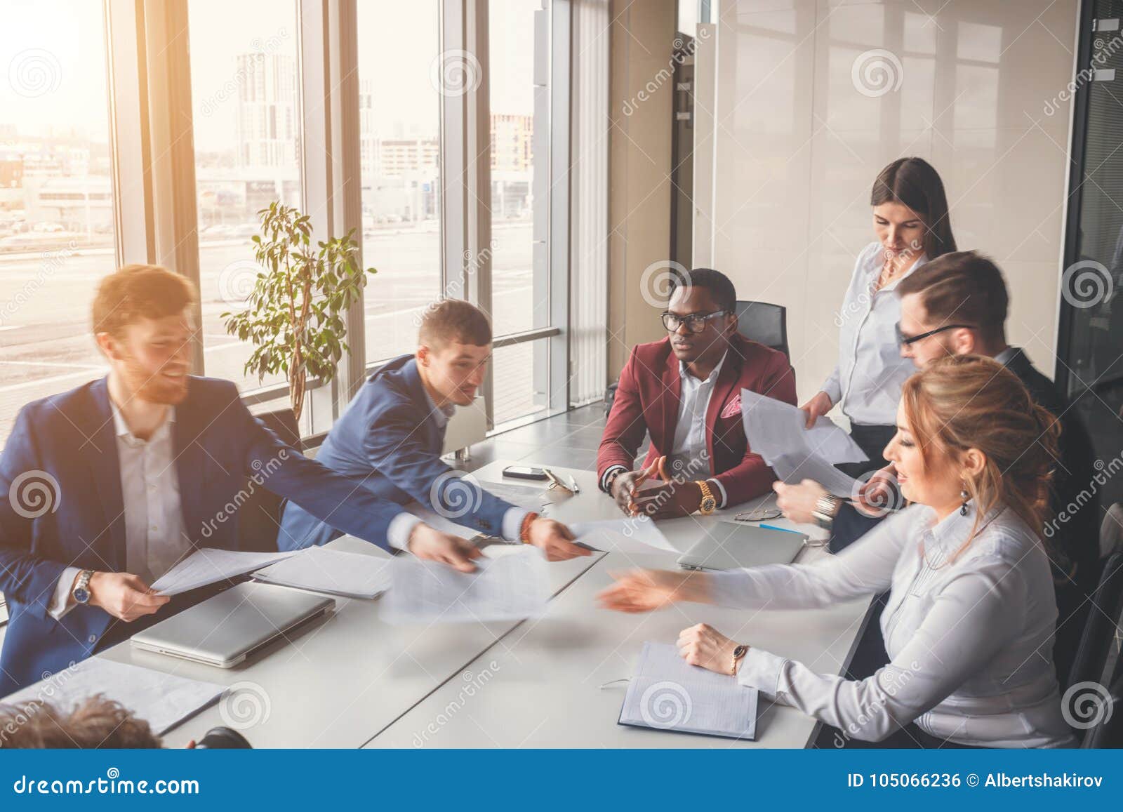 Thinking African Business Man Surrounded by Moving People Stock Photo ...