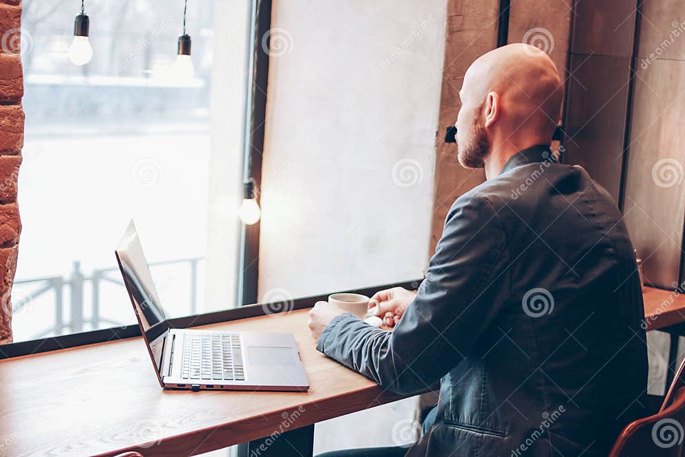 Thinking Attractive Adult Successful Bald Bearded Man In Suit With