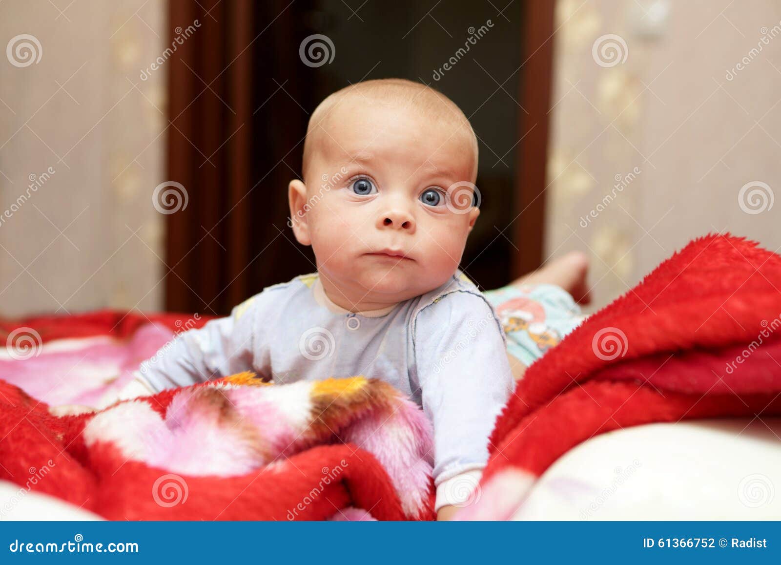 Thinking baby boy on a bed stock photo. Image of baby - 61366752