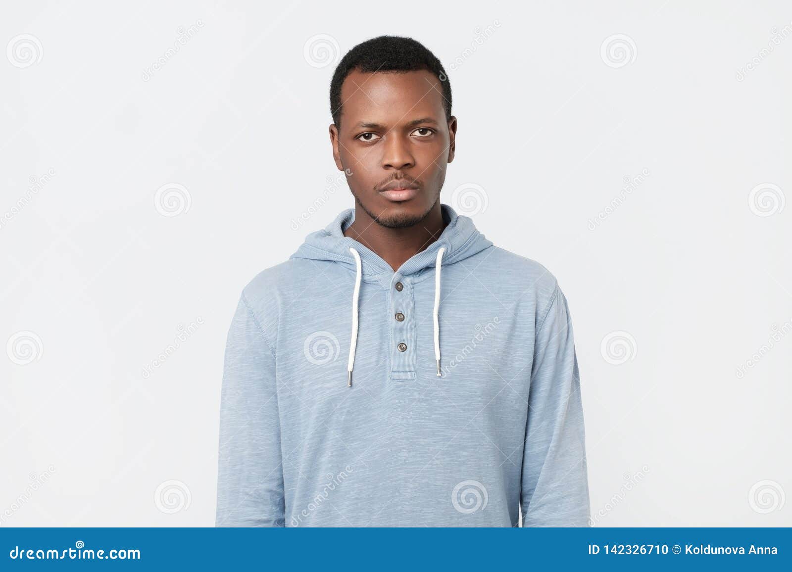 African Man with Serious Expression Looking at Camera while Posing ...