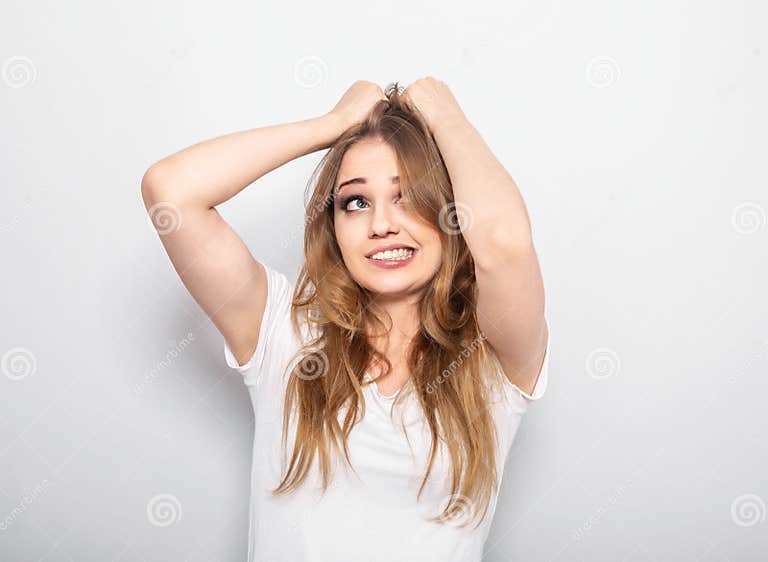 Thinking Blond Doubt Grimacing Woman Looking Up And Thinking Holding
