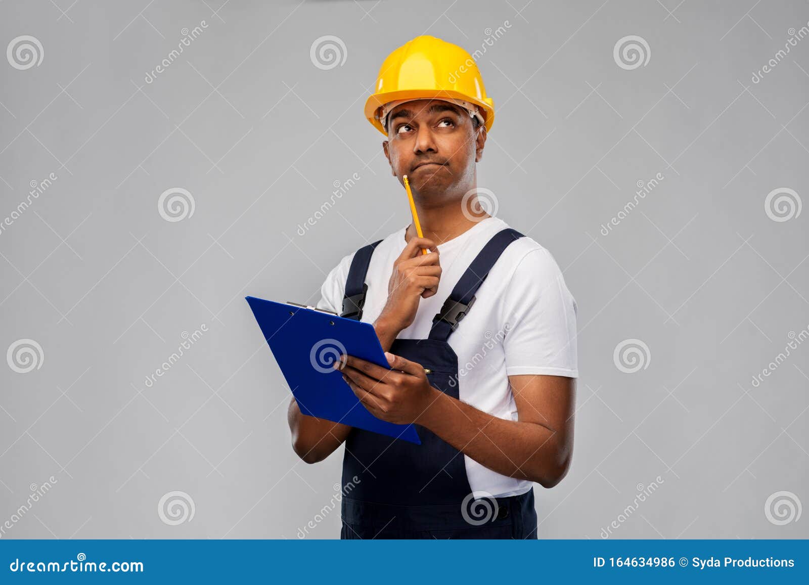 Thinking Builder with Clipboard and Pencil Stock Photo - Image of ...