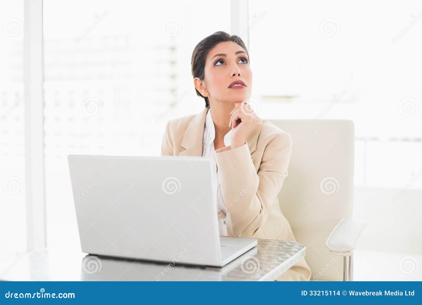 Thinking Businesswoman Working with a Laptop Stock Photo - Image of ...