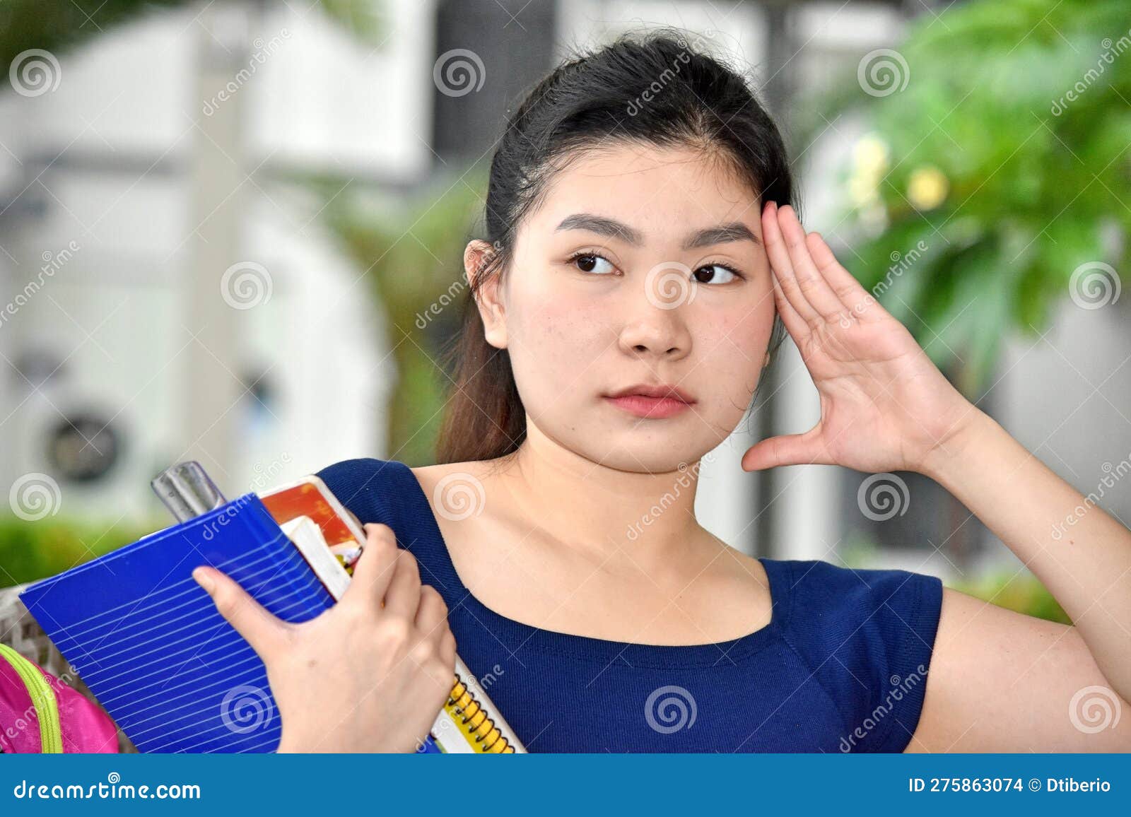 A Thinking Chinese Female Student Stock Photo - Image of analytical ...