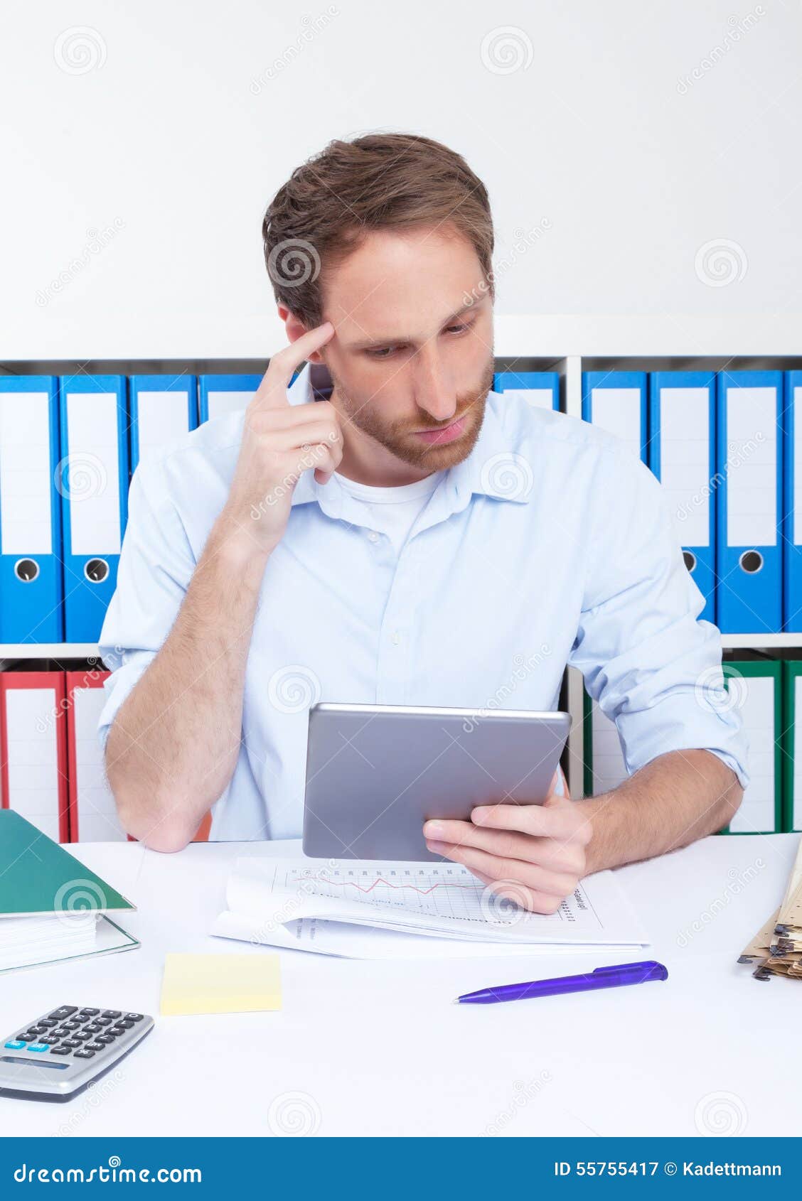 Thinking German Businessman with Tablet Computer at Office Stock Image ...