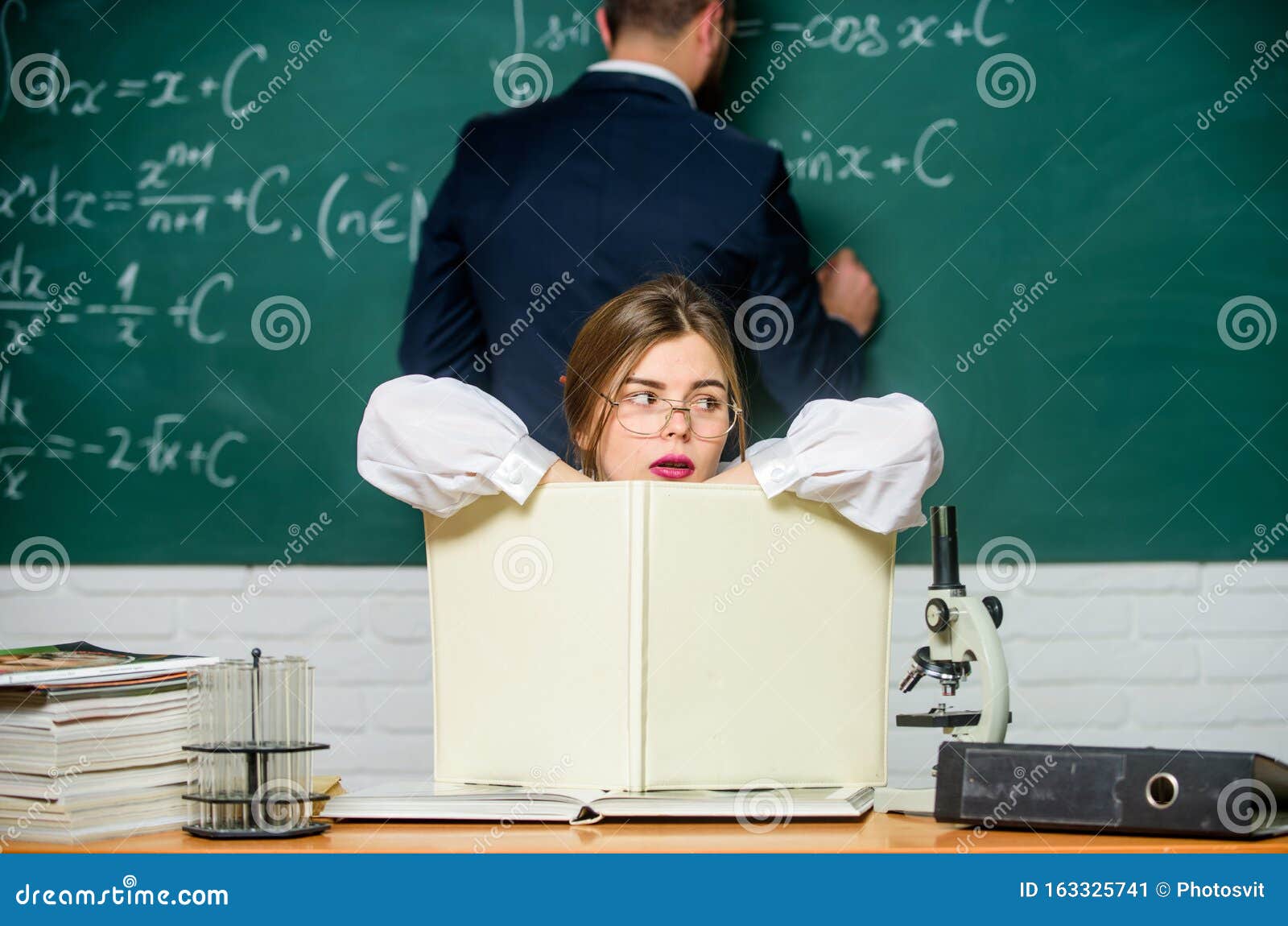 Thinking Hard. Pretty Teacher Giving Homework. Student Writing Homework ... Thinking Hard. Pretty Teacher Giving Homework. Student Writing Homework ...