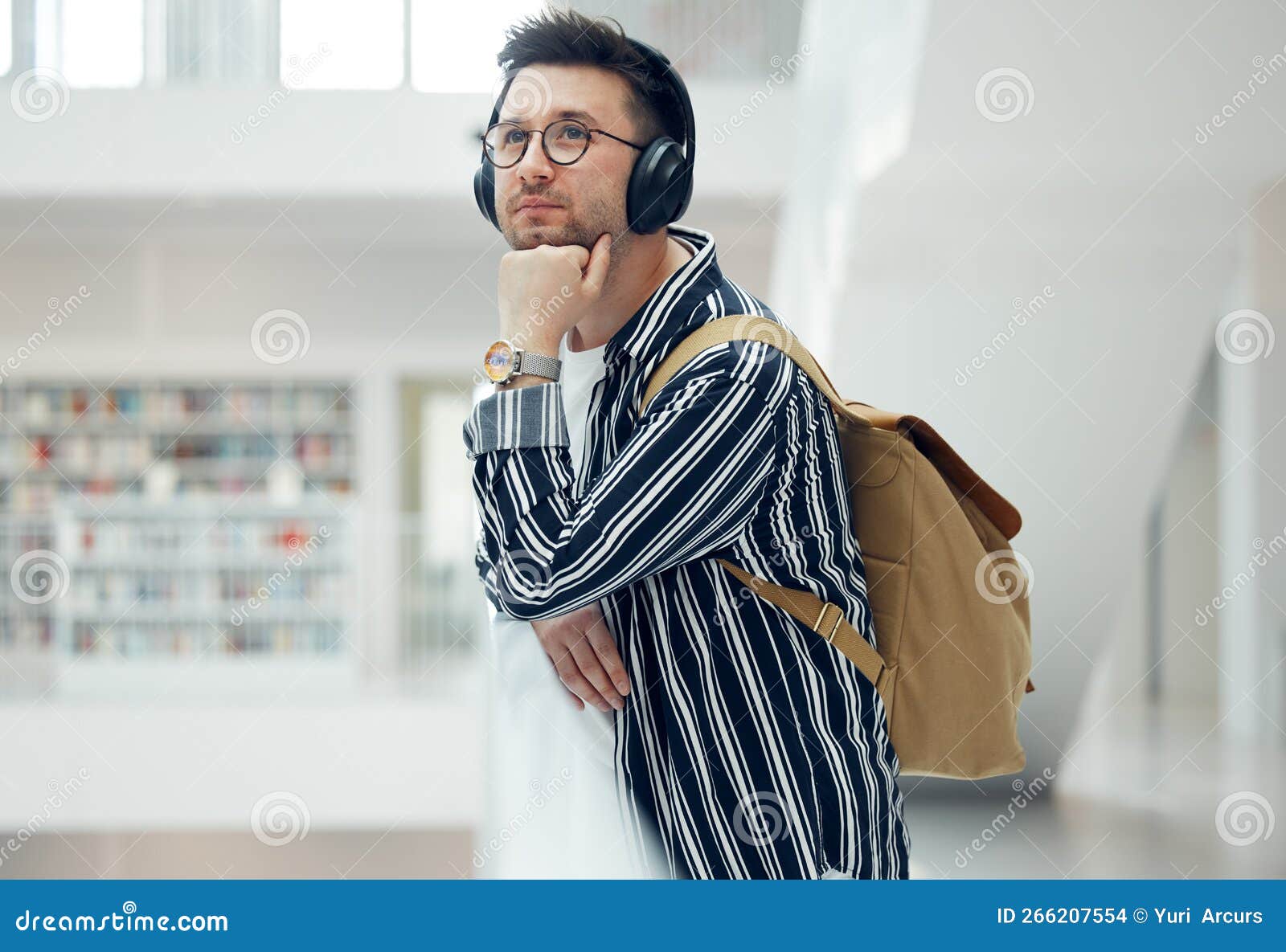 Thinking, Headphones and Library Student at University, College or ...