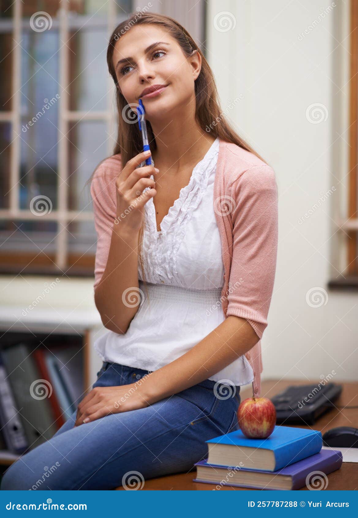 Thinking about Her Next Class. a Beautiful Young Teacher Sitting in Her ...