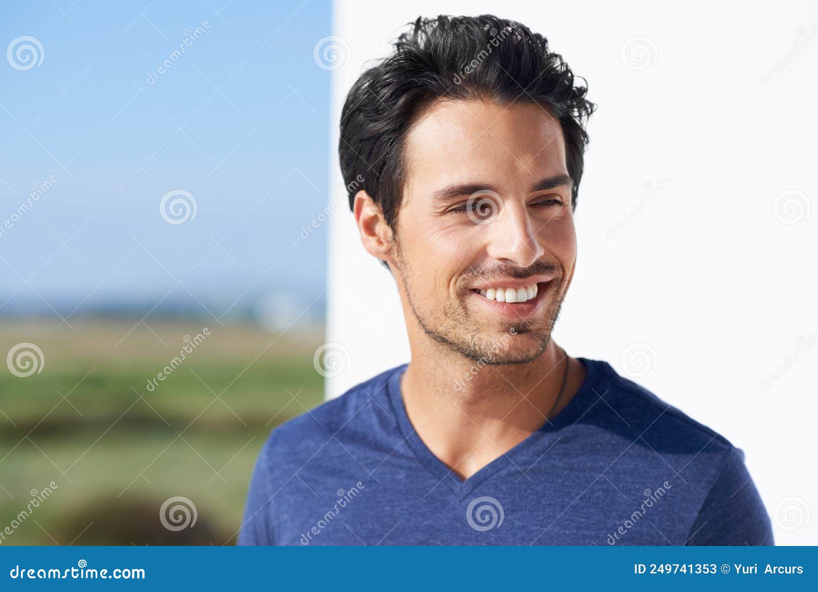 Thinking of a Joke. Portrait of a Handsome Young Man Standing Outside ...